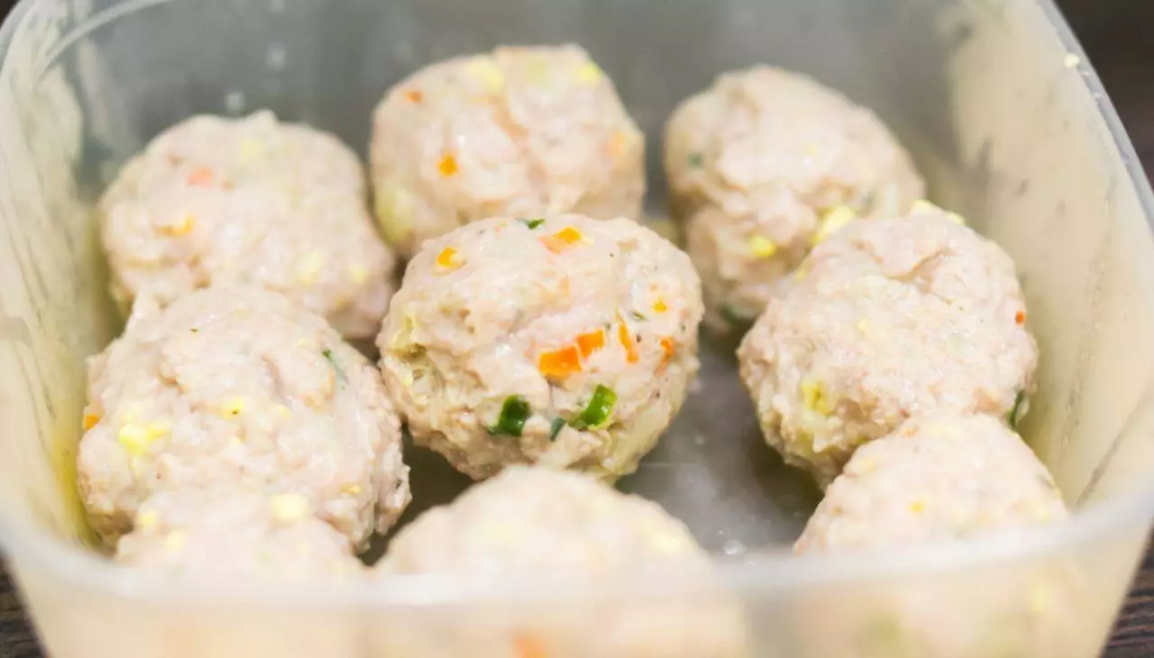 Raw meatballs with sandwich bread, fish and vegetables