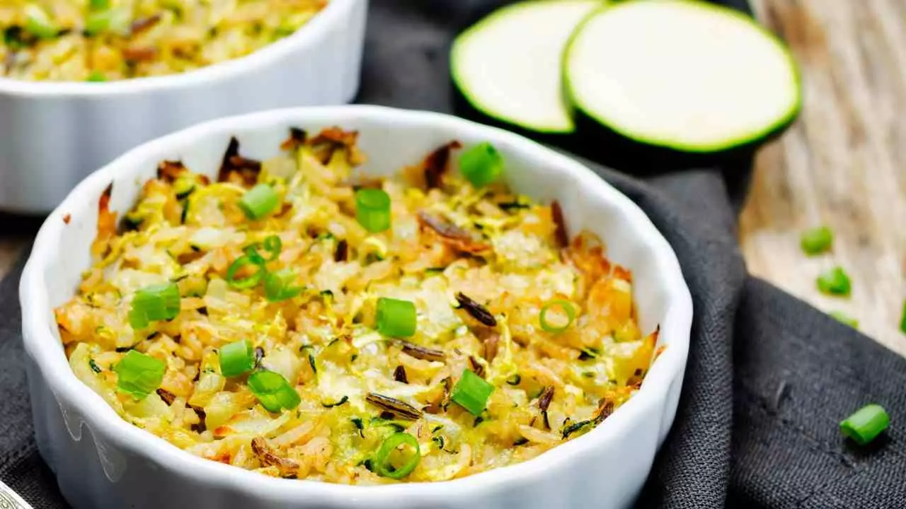 Baked rice with courgettes, bacon and scamorza cheese