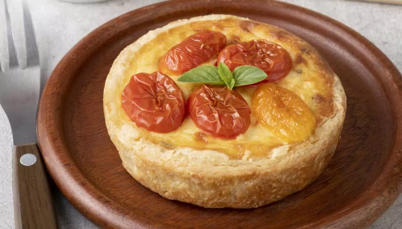 Savory pie of shortcrust pastry with basil