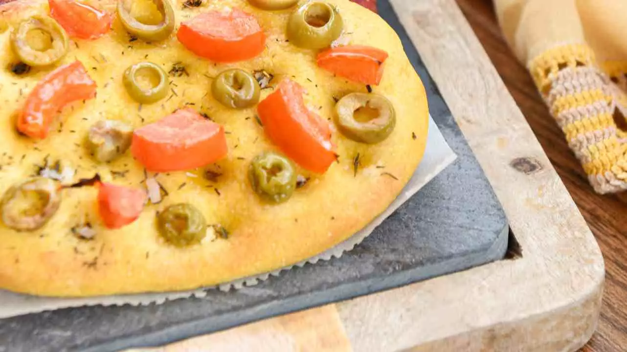 Pumpkin focaccia with tomatoes and olives