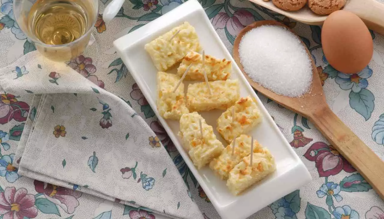 Reggiana rice cake | Recipe e tloaelehileng ea Emilia Romagna bakeng sa dessert e bonolo le e monate