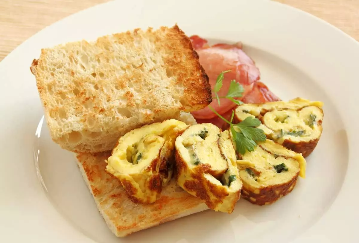 Omelette roll with vegetables and bresaola a complete dish