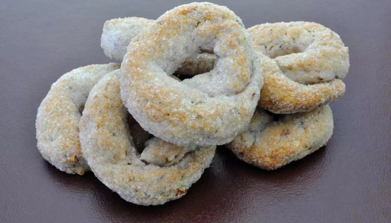 Zocker-beschichtete Orange a Walnuss Donuts - Ricettasprint